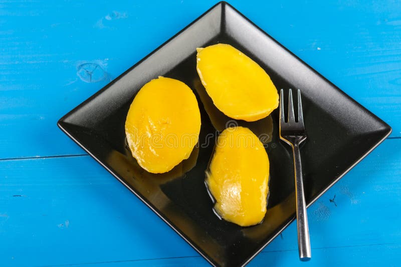 Mango Compote Served on the Plate with Fork Stock Image - Image of ...