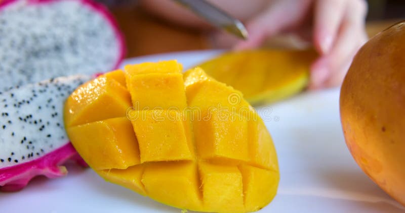 A Mango and a Costa Rican Pitahaya are on the Cutting Board Stock Video ...