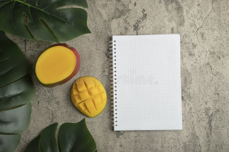 Mango with Cubes and Empty Notebook Paper on Marble Surface Stock Photo ...