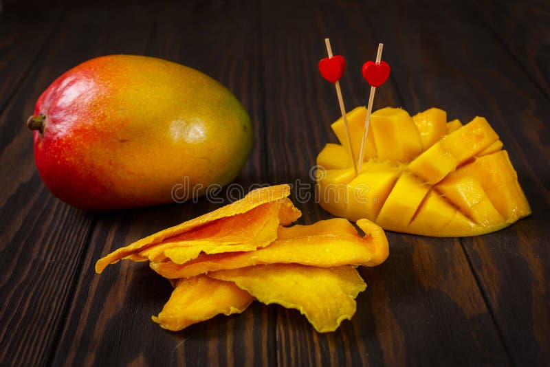 Mango on a Dark Brown Wooden Table Stock Photo - Image of heap, mango ...
