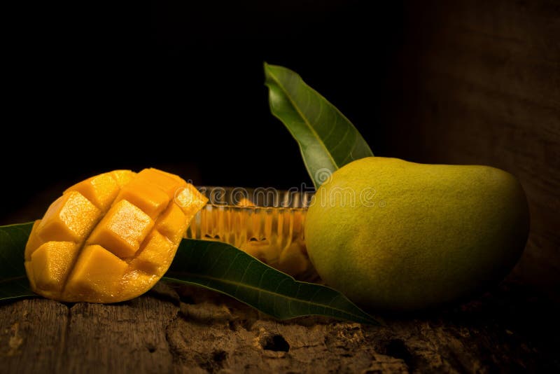 Mango on a Dark Wood Background Stock Image - Image of crystal, leaves ...