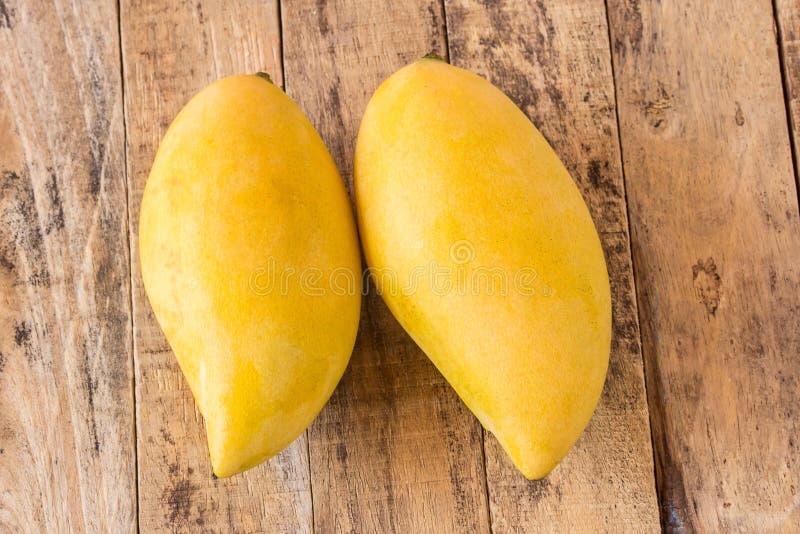 Mango Fruit On Old Wooden Table Stock Image - Image of pulp, organic ...