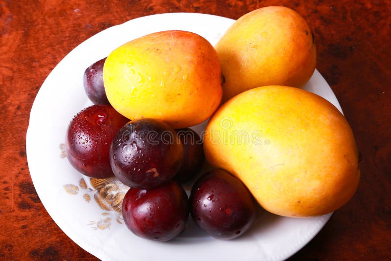 Mango and plum Fruits stock image. Image of green, copy - 104988967