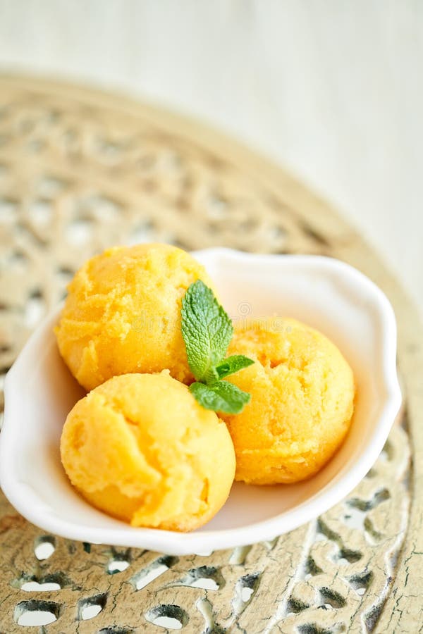 Mango Ice Cream with Mint Leaf. Three Balls in a White Bowl on a ...