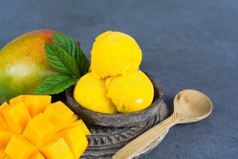Mango Ice Cream Sorbet with Mint Leaves and Mango Fruit in Black Stock ...