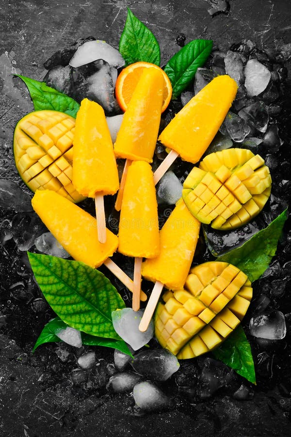 Mango Ice Cream on a Stick. Fresh Mango Yellow Popsicles. on a Black ...
