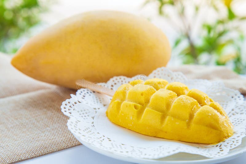 A Mango Ice Cream Stick on a White Plate with Mango Fruit on White ...