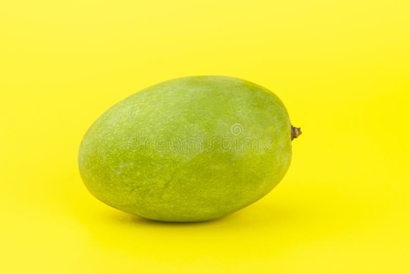 A Mango Isolated on Yellow Background. Stock Photo - Image of ...
