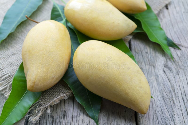 Mango with Leaves on Wooden Table Background Stock Photo - Image of ...