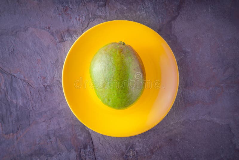 Mango Lying on a Yellow Plate Stock Image - Image of rural, organic ...