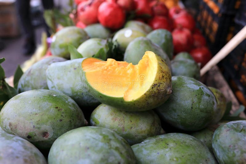 Mango in market stock photo. Image of outdoors, juicy - 163116912