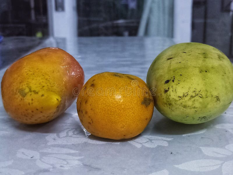 Mango with Mini Papaya and Orange Fruits on the Table Stock Image ...