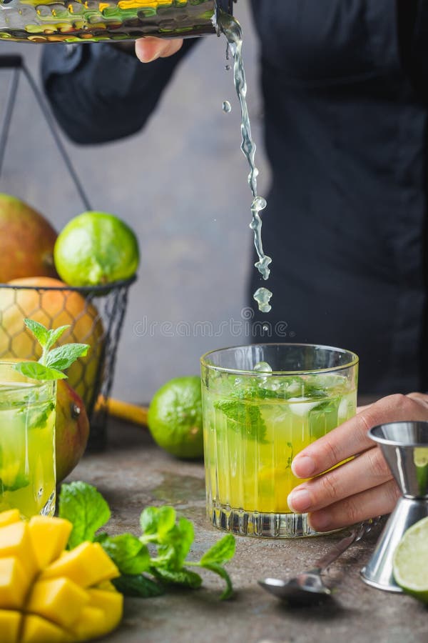Mango mint mojito cocktail stock photo. Image of glass - 140281190
