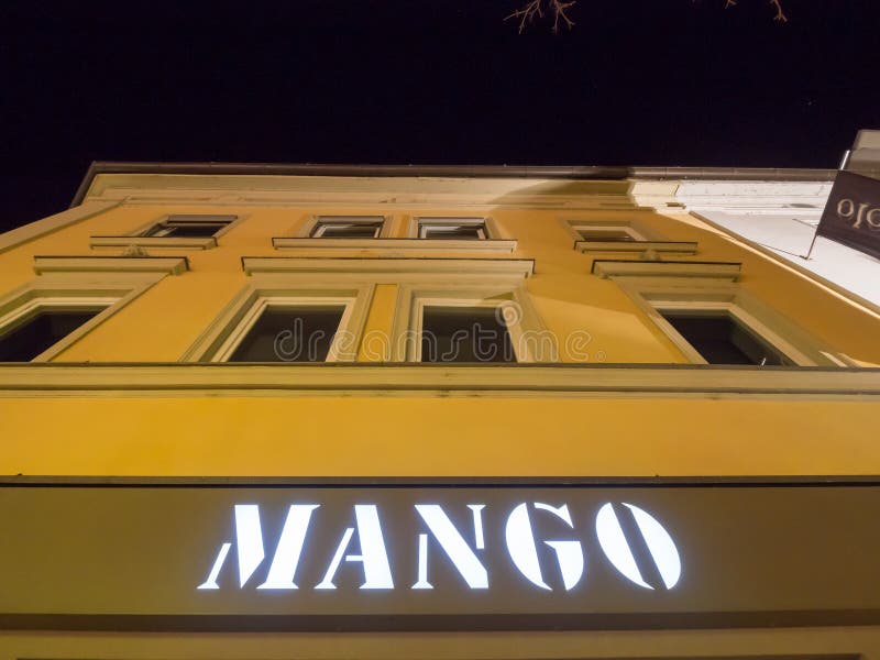 Mango at night editorial photo. Image of sign, facade - 64294041