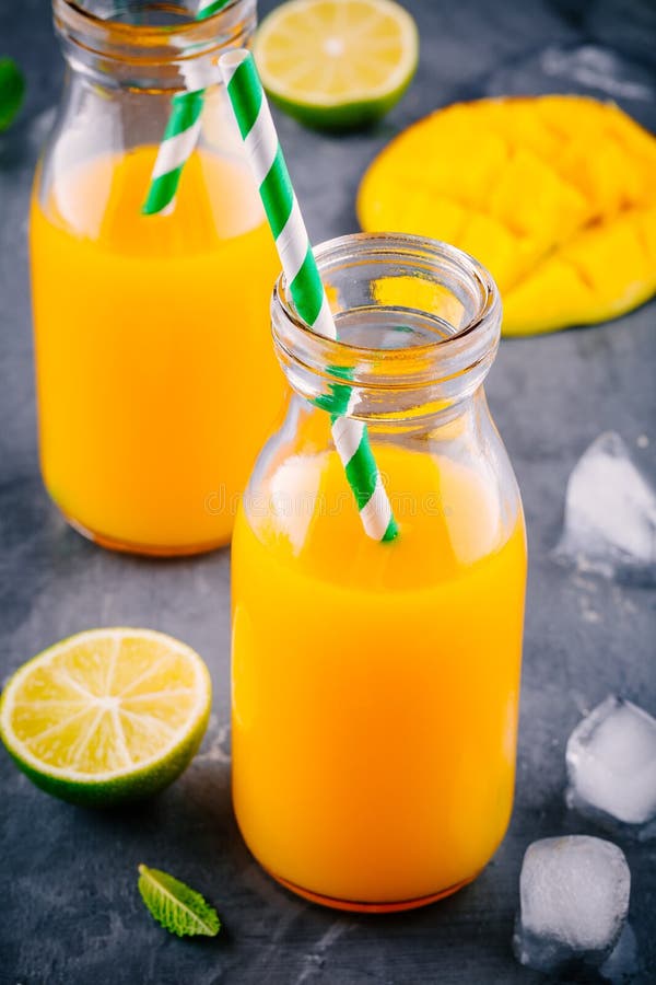Mango Orange Juice with Ice and Lime Stock Photo - Image of close, leaf ...