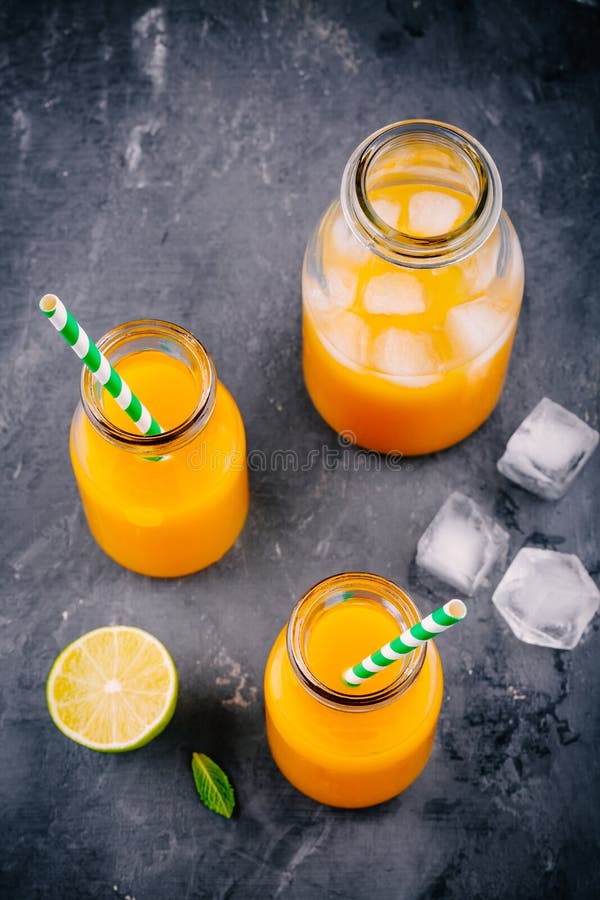 Mango Orange Juice with Ice and Lime Stock Photo - Image of drinks ...