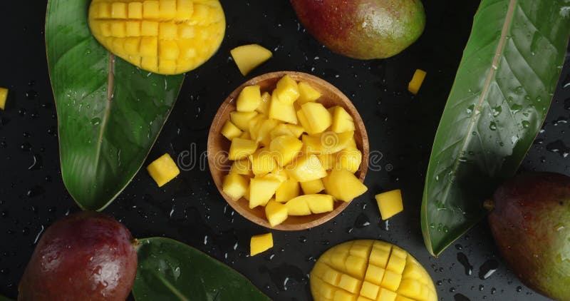 The Mango Pieces on Plate Falling Water Drops. Stock Video - Video of ...