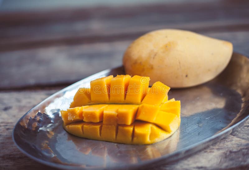 Mango in a plate stock photo. Image of delicious, golden - 121671764