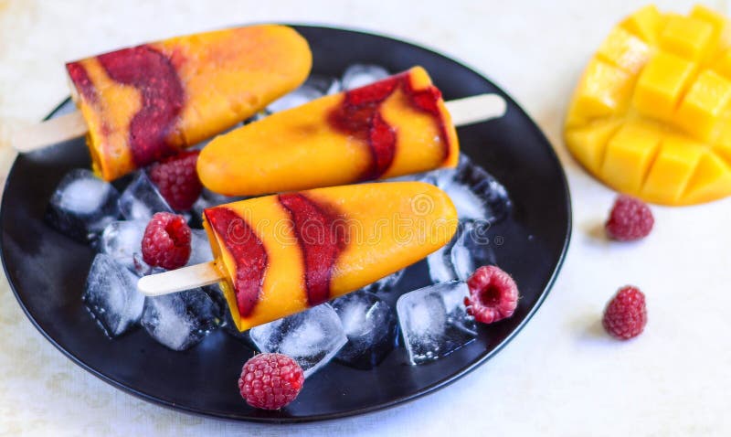 Mango and Raspberry Popsicle Stock Photo - Image of frost, pink: 83484924