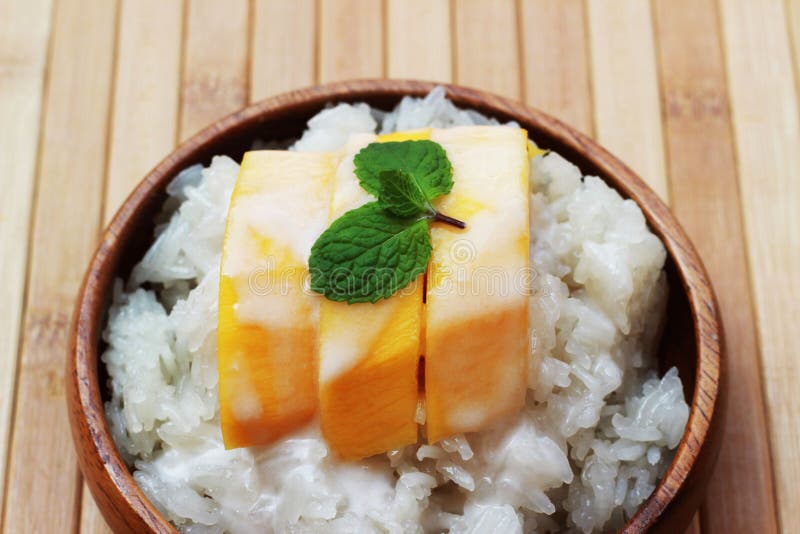 Mango Sticky Rice is Put in a Wooden Container Placed on a Brown Stock ...