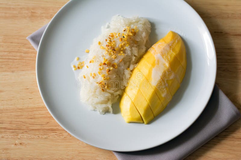 Mango with Sticky Rice in White Plate on Wooden Table Stock Photo ...