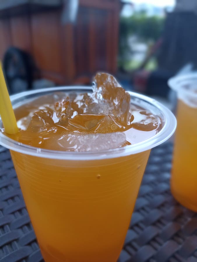 Mango Syrup with Ice Cubes on Top Still Looks Refreshing Even Though ...
