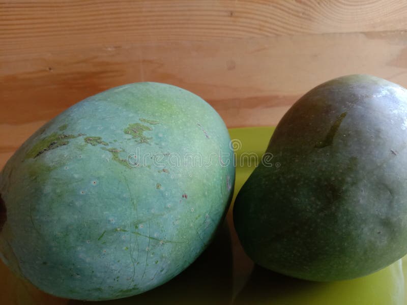 Mango on the Table with Wooden Background. Stock Image - Image of ...