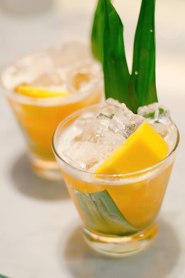 Mango Yellow Cocktail Decorated with Leaves Stock Photo - Image of ...
