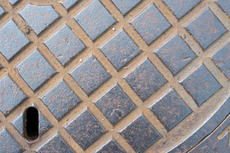 Manhole Cover with Hole and Rust Stock Photo - Image of floor, hole ...