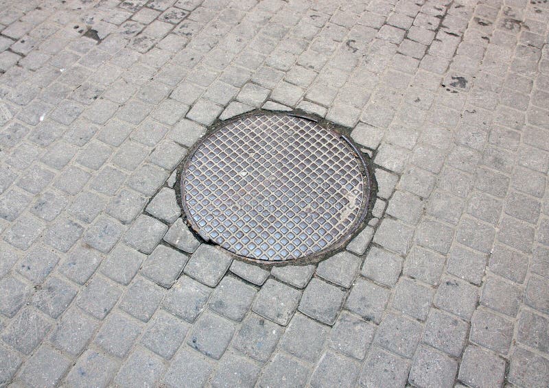 Manhole Cover on the Street. Stock Photo - Image of cover, stone: 27141562
