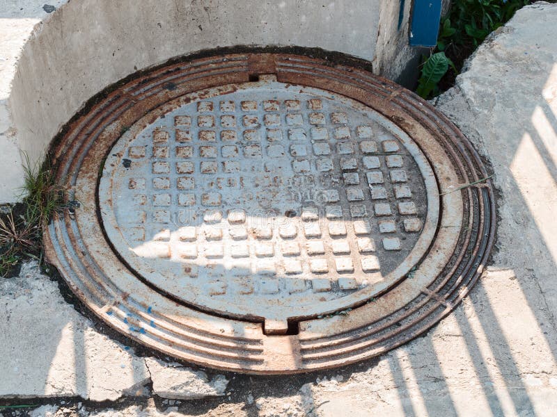 Manhole on the road stock image. Image of pavement, cover - 26120183