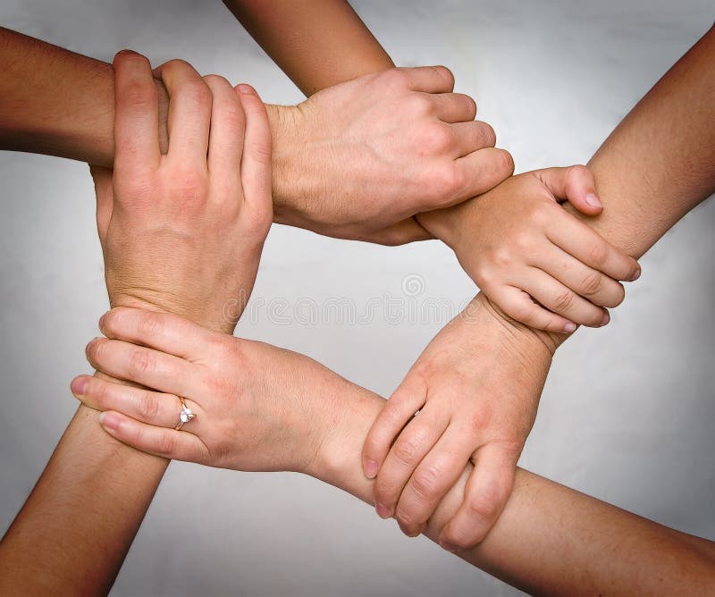 Quattro mani unite fotografia stock. Immagine di associazione - 2677462