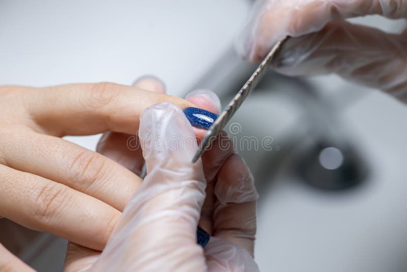 Manicure Master Filing Nails with Applied Gel Polish Stock Image ...