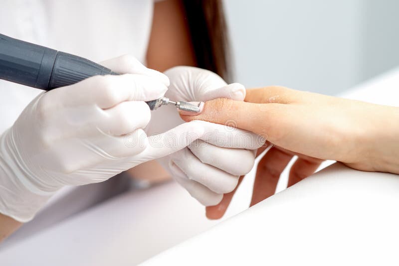 Manicure Master Uses an Electric Nail Machine Stock Image - Image of ...