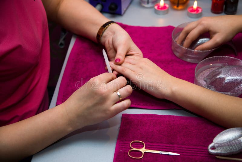 A manicure is in a salon stock image. Image of client - 8646219