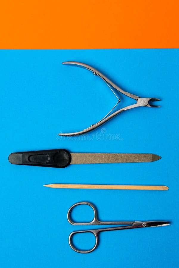Manicure Set on a Blue Background on an Orange Background Stock Image ...