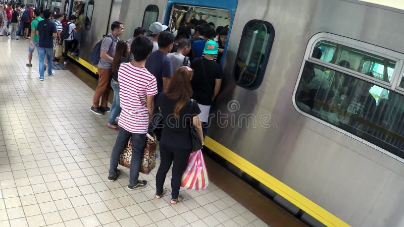 Passengers Boarding Light Rail Train at Station Stock Footage - Video ...