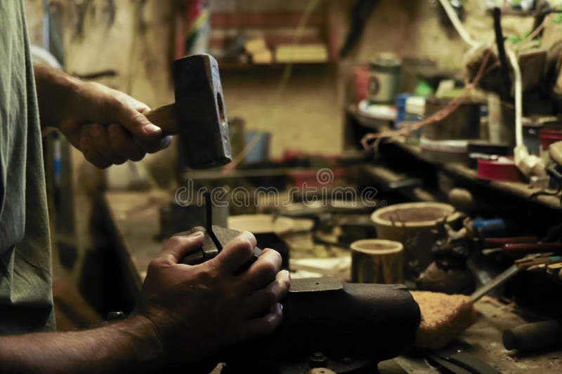 Man Working in an Old Retro Workshop with Dim Light. Atmospheric Stock ...