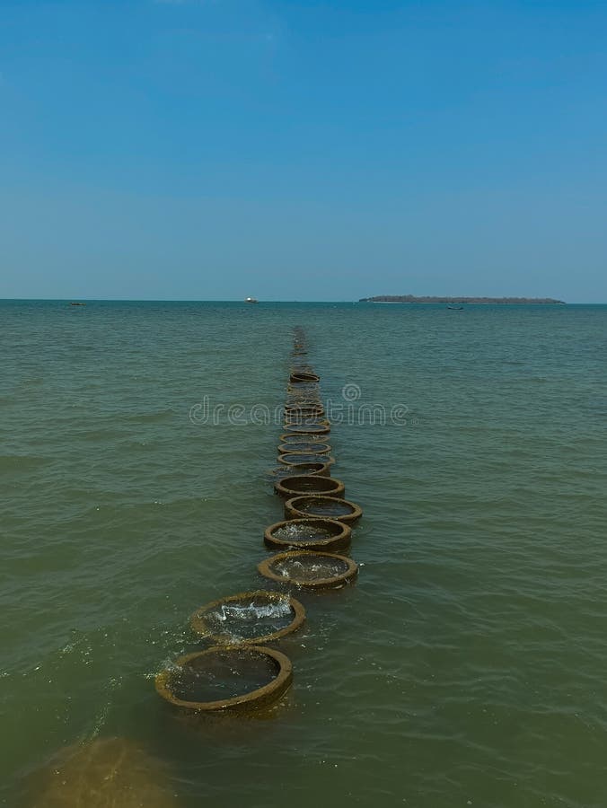 Manmade Pathway of Circular Structures Leading Far into the Sea with ...