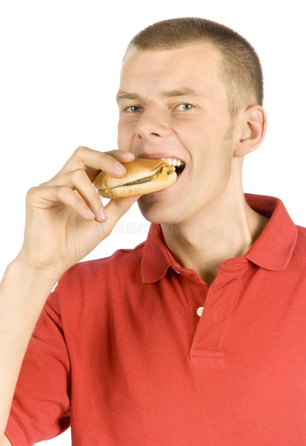Mann isst Burger stockfoto. Bild von köstlich, isolat - 1110754