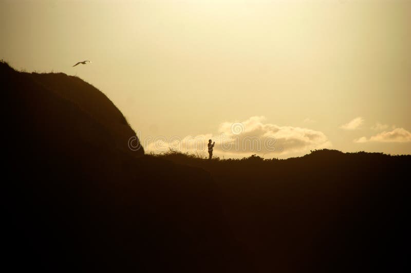 A Mann Walks at the Horizon Stock Image - Image of beach, rock: 91264897