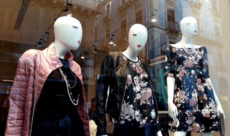 Mannequins Displaying Clothes at a Store Window Stock Photo - Image of ...
