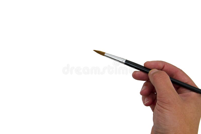Mano che tiene un pennello immagine stock. Immagine di barretta - 12149185