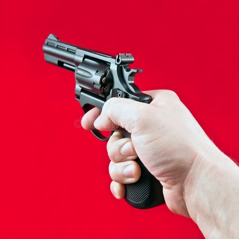 Mano con el revólver foto de archivo. Imagen de cilindro - 35974168