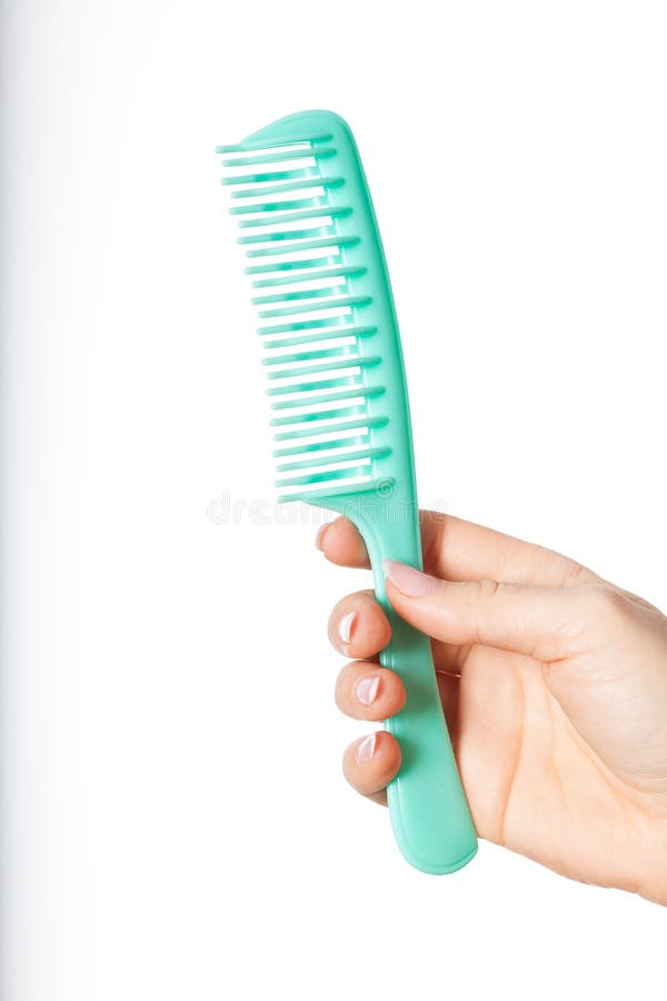 Mano humana con el peine imagen de archivo. Imagen de dedos - 38791733