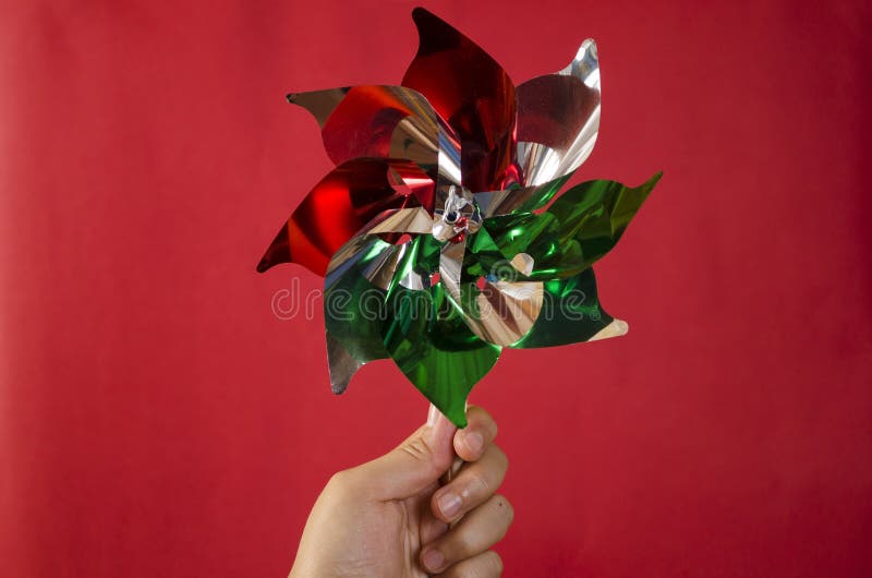 Mano Que Lleva a Cabo Un Rehilete Mexicano Foto de archivo - Imagen de ...