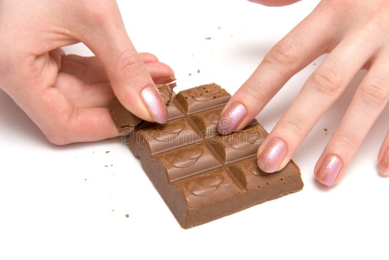 Chocolate y manos de mujer foto de archivo. Imagen de elegante - 2358520