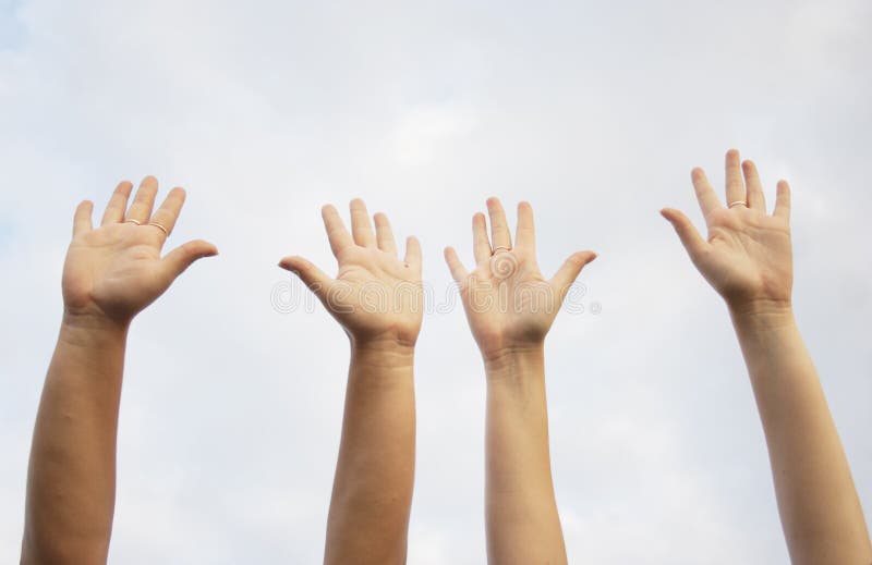 Manos levantadas juntas imagen de archivo. Imagen de diverso - 22885651