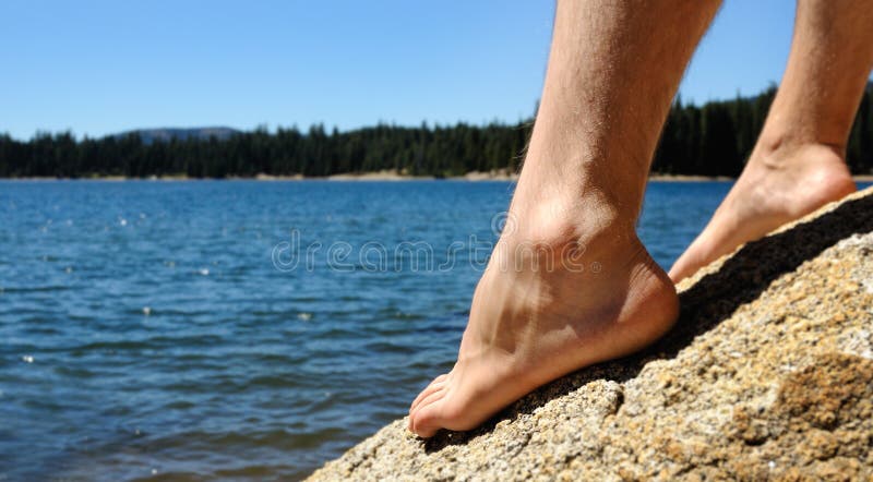 Mans Feet On Big Rock Near Lake Stock Image - Image of white, sunlight ...