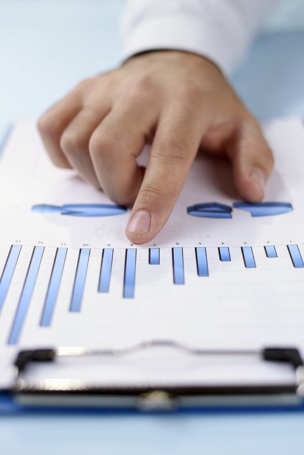 Mans Finger Pointing at a Bar Graph Stock Photo - Image of analyst ...